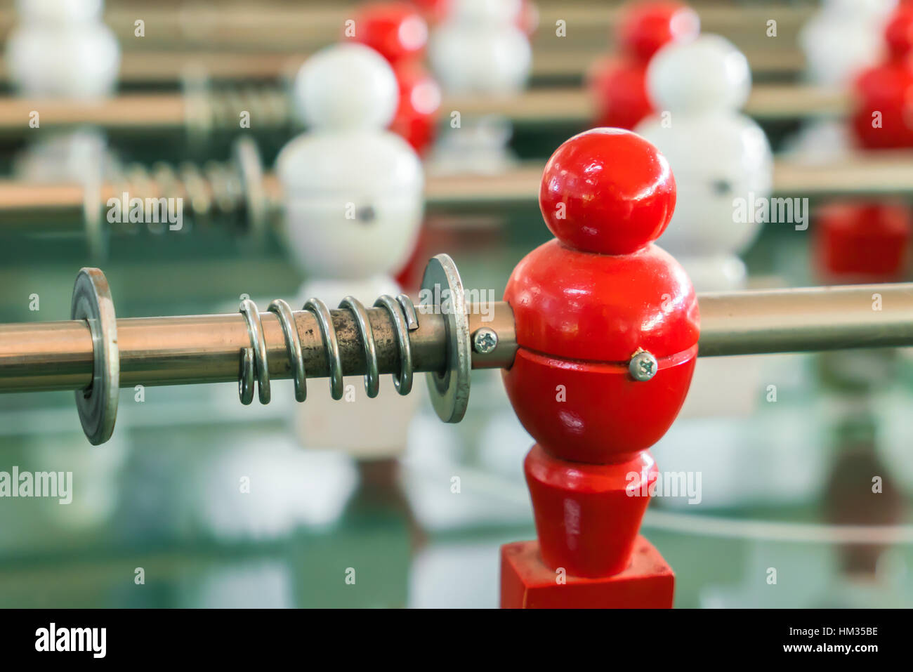 Football table game with red and white player Stock Photo - Alamy