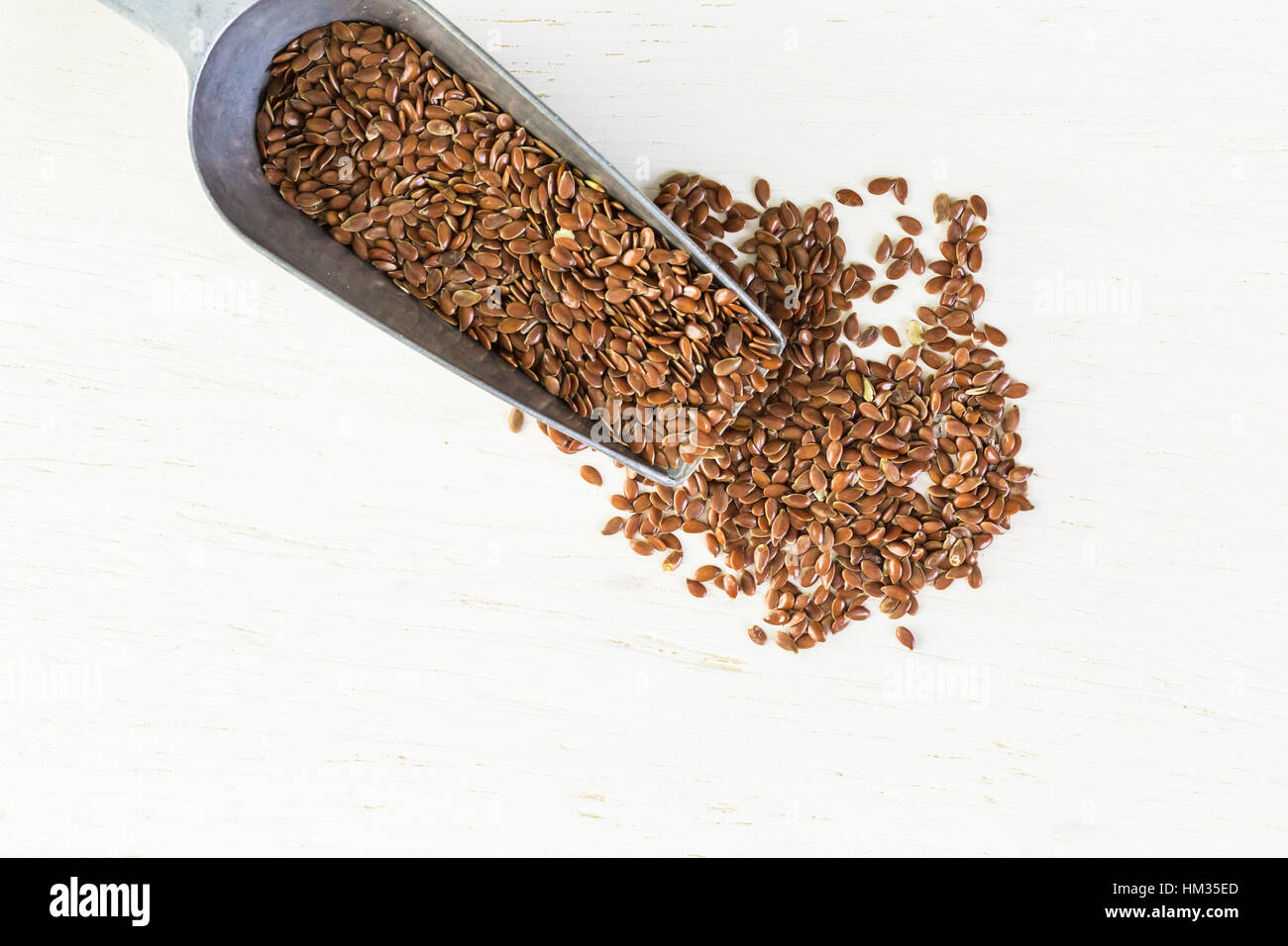 Flax seeds on painted wood board Stock Photo - Alamy