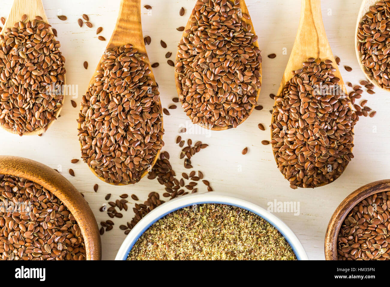 Flax seeds on painted wood board Stock Photo - Alamy