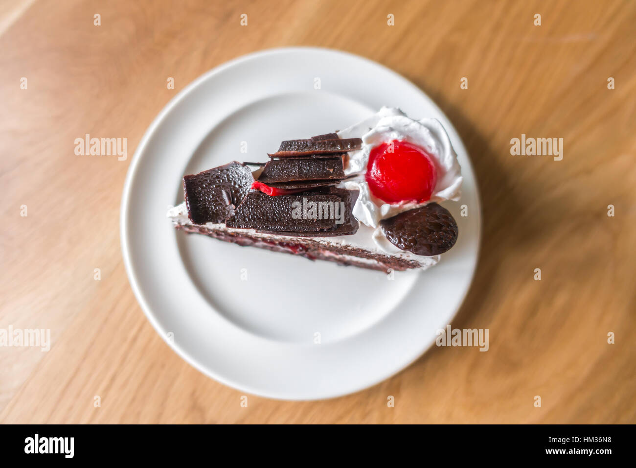 Chocolate cake with red cherries Stock Photo - Alamy