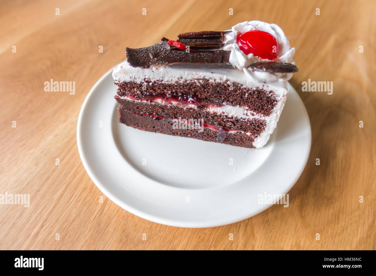 Chocolate cake with red cherries Stock Photo - Alamy