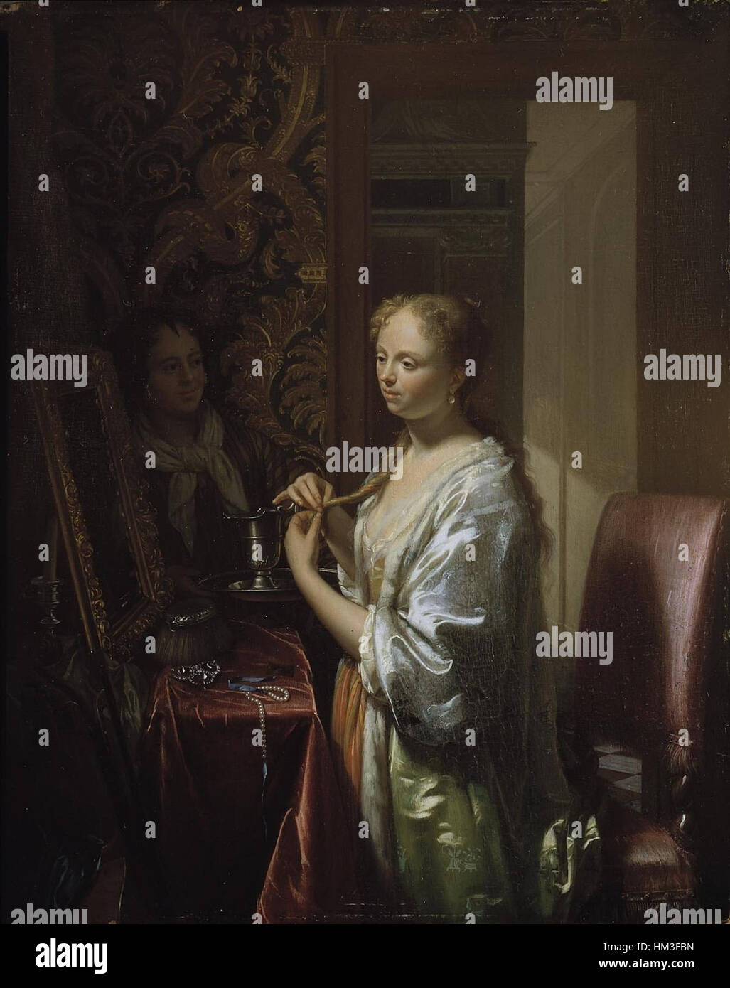 This painting depicts a lady engaged in her personal grooming or toilet ...
