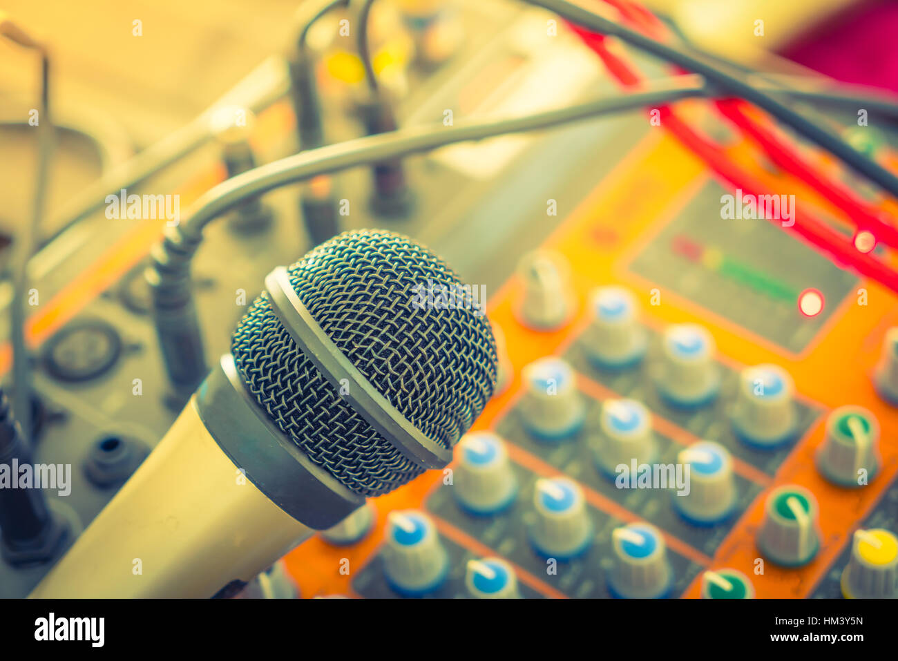 Microphone and Music mixer desk with various knobs ( Filtered image ...