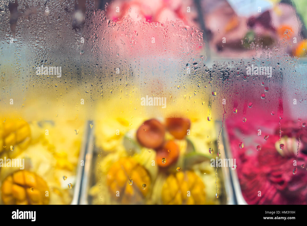 Water drop over Fresh fruits ice cream background Stock Photo - Alamy
