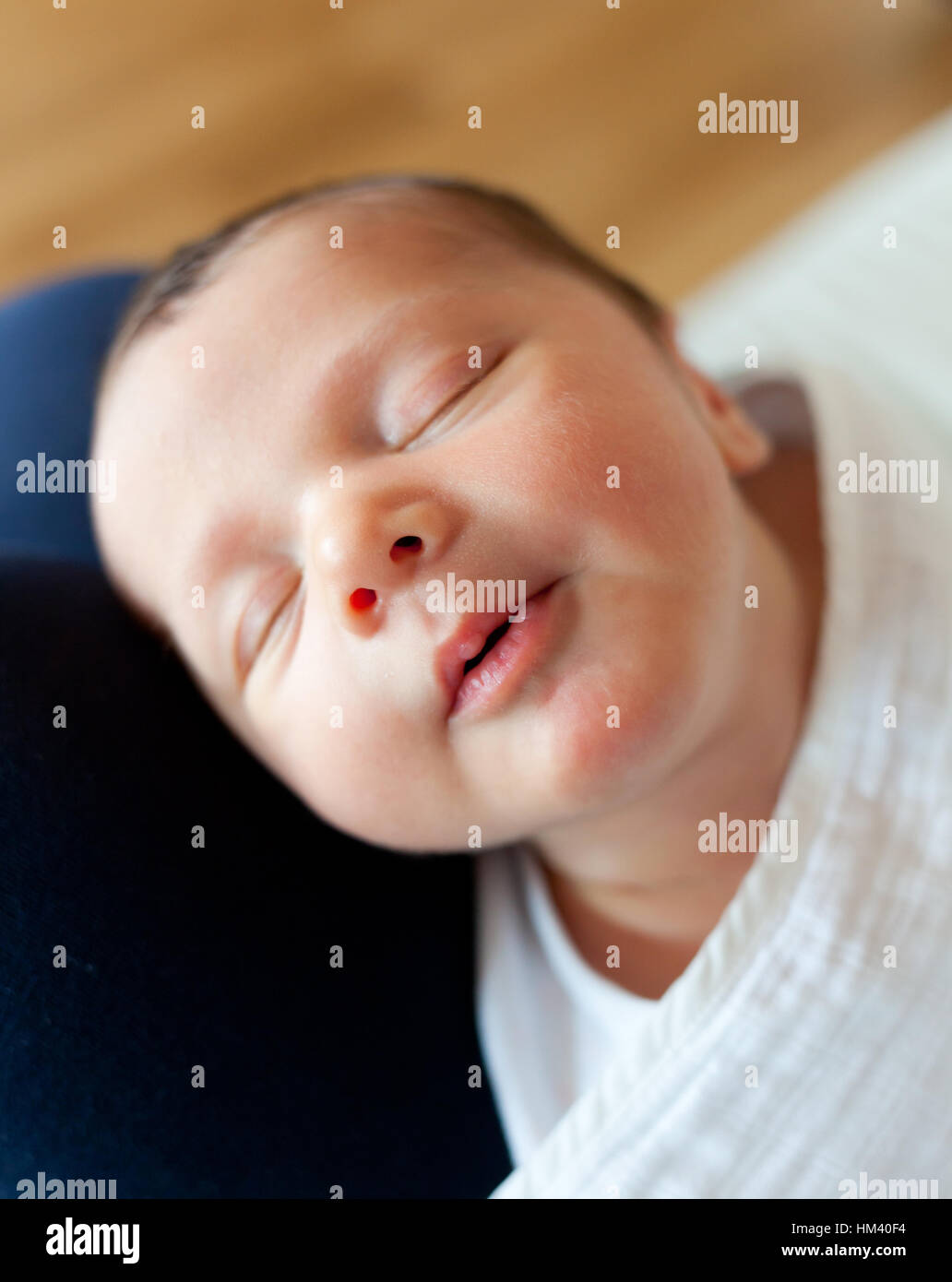 Portrait of sleeping newborn baby girl with smile Stock Photo - Alamy
