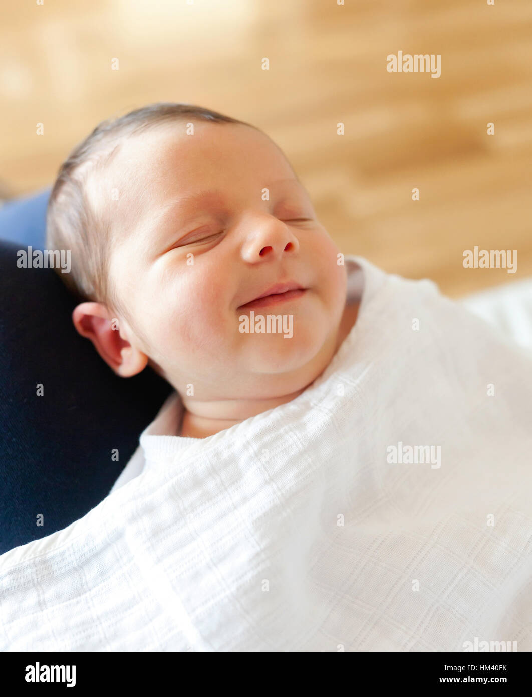 Portrait of sleeping newborn baby girl with smile Stock Photo - Alamy