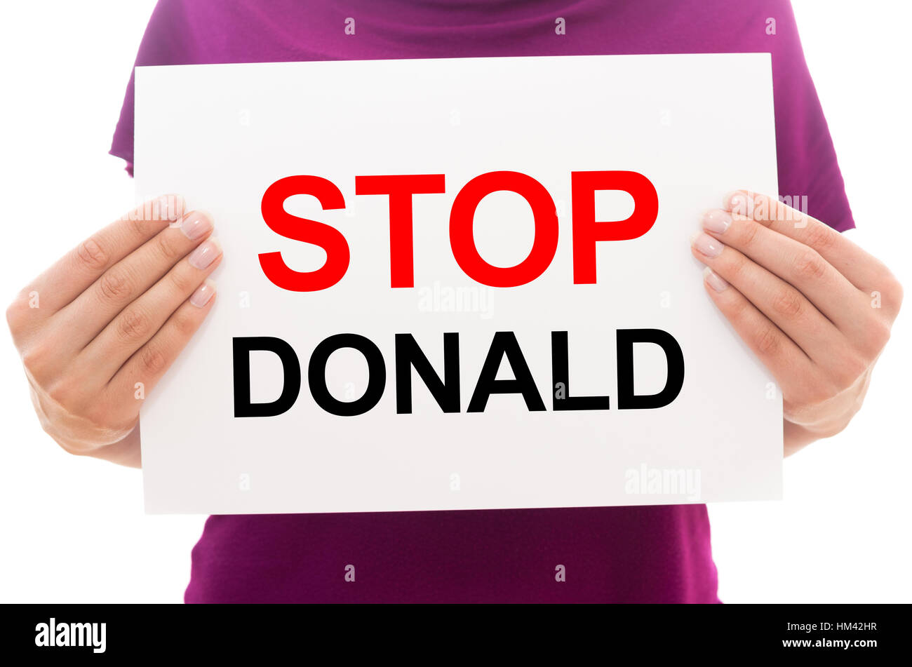 Girl holding white paper sheet with text STOP DONALD Stock Photo - Alamy