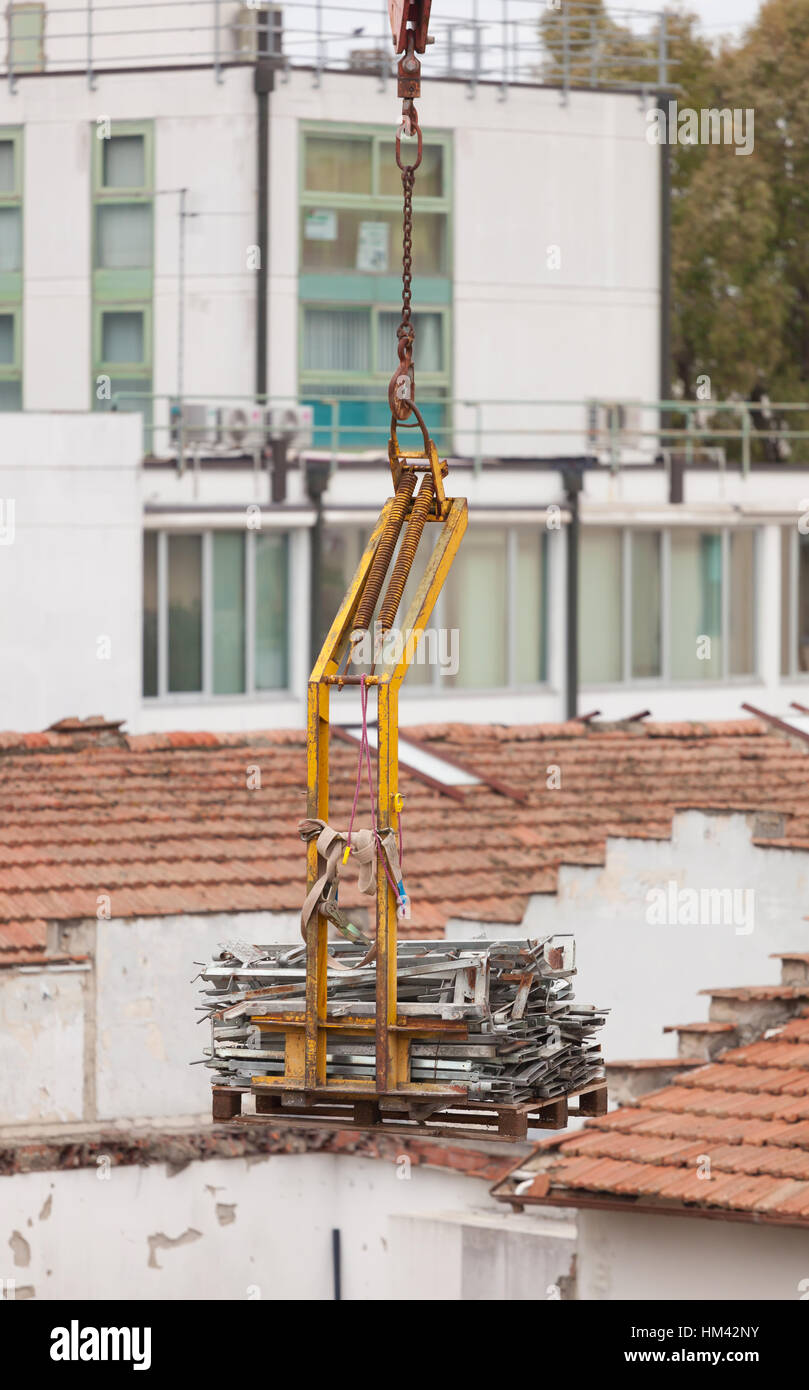 Construction site with the crane moving steel Stock Photo - Alamy