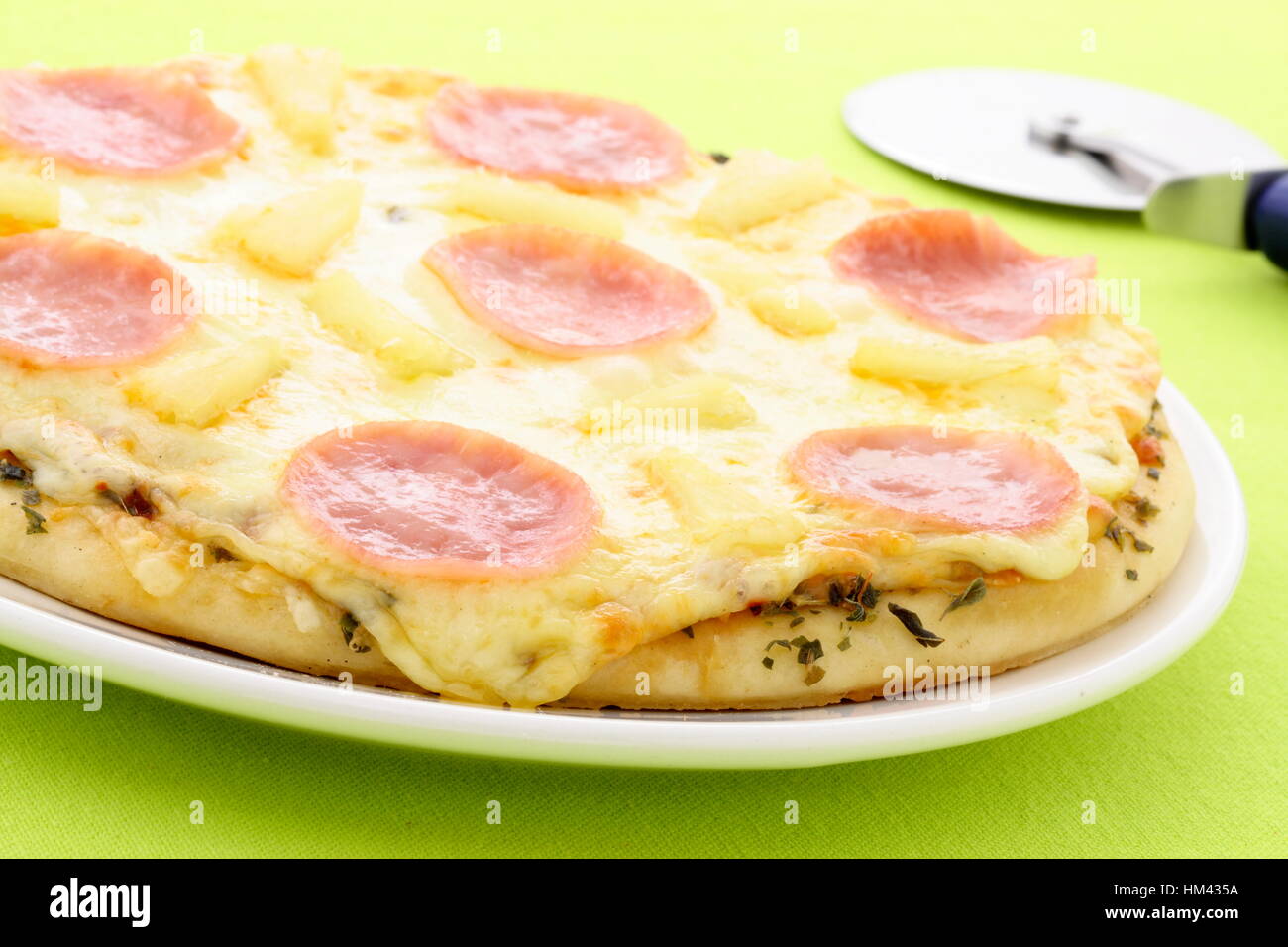 delicious hawaiian rustic style pizza made with fresh pineapples,ham ...