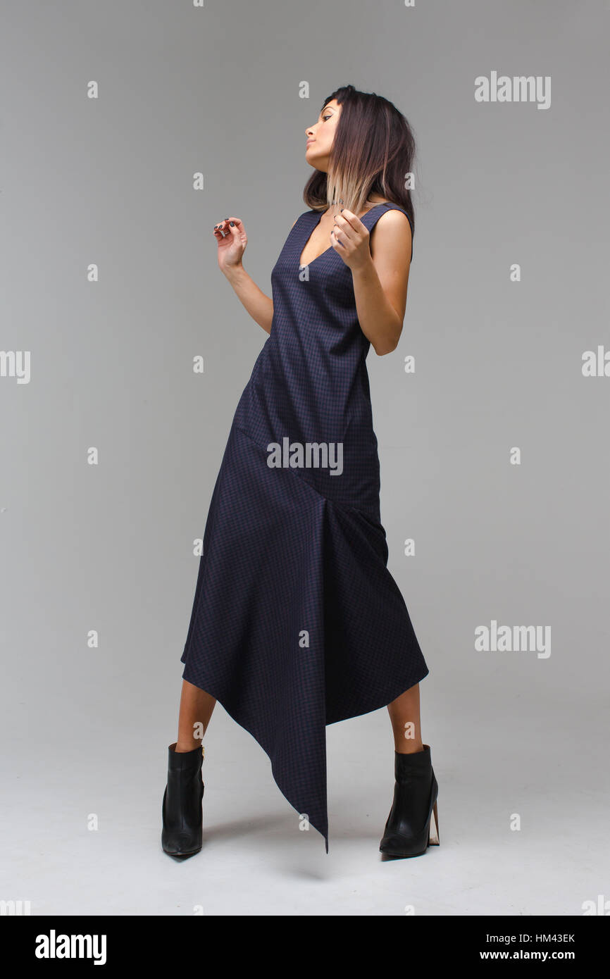 Woman looking up pretending like she is dancing Stock Photo - Alamy