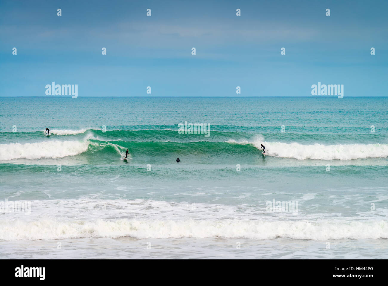 Adelaide, Australia - August 14, 2016: Surfers sliding the waves at ...