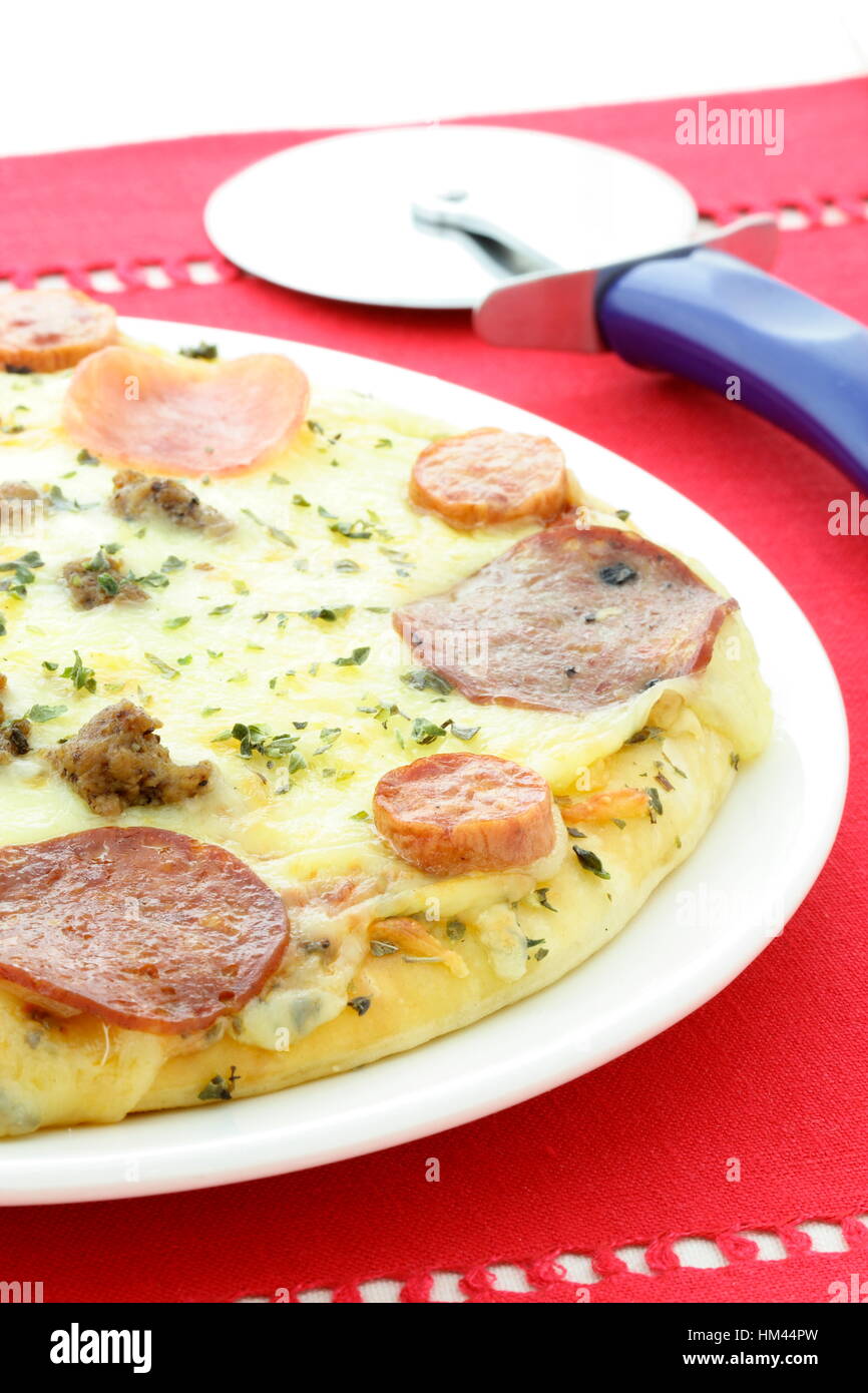 hot ready to eat delicious rustic meat lovers pizza Stock Photo - Alamy