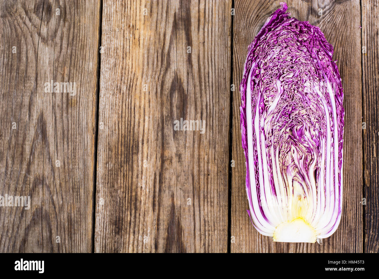 Cut red bok choy on a wooden background Stock Photo - Alamy