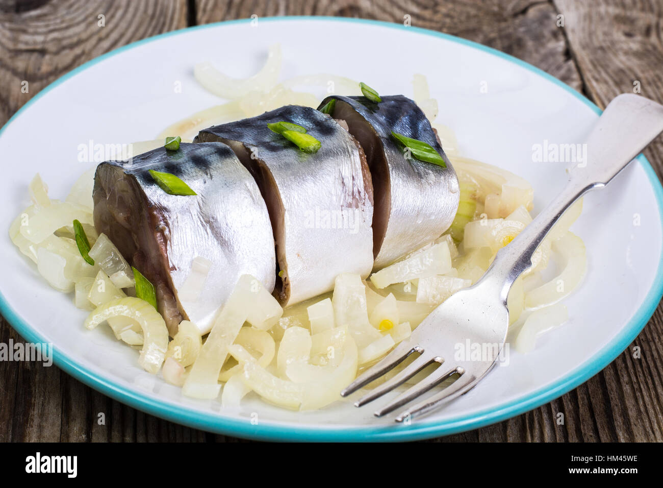 Fish appetizer: slices marinated mackerel Stock Photo - Alamy