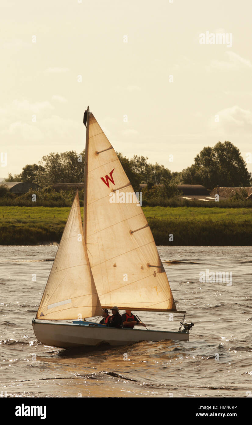 Small sailing boats riding the Severn Bore wave, River Severn, Newnham ...