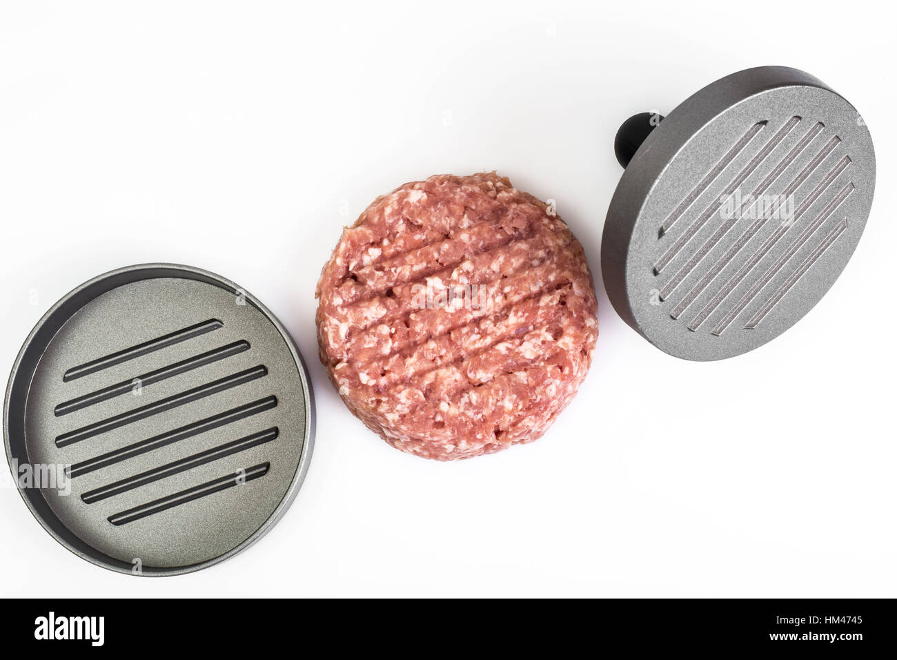 Stuffing and press for burger on white background Stock Photo - Alamy