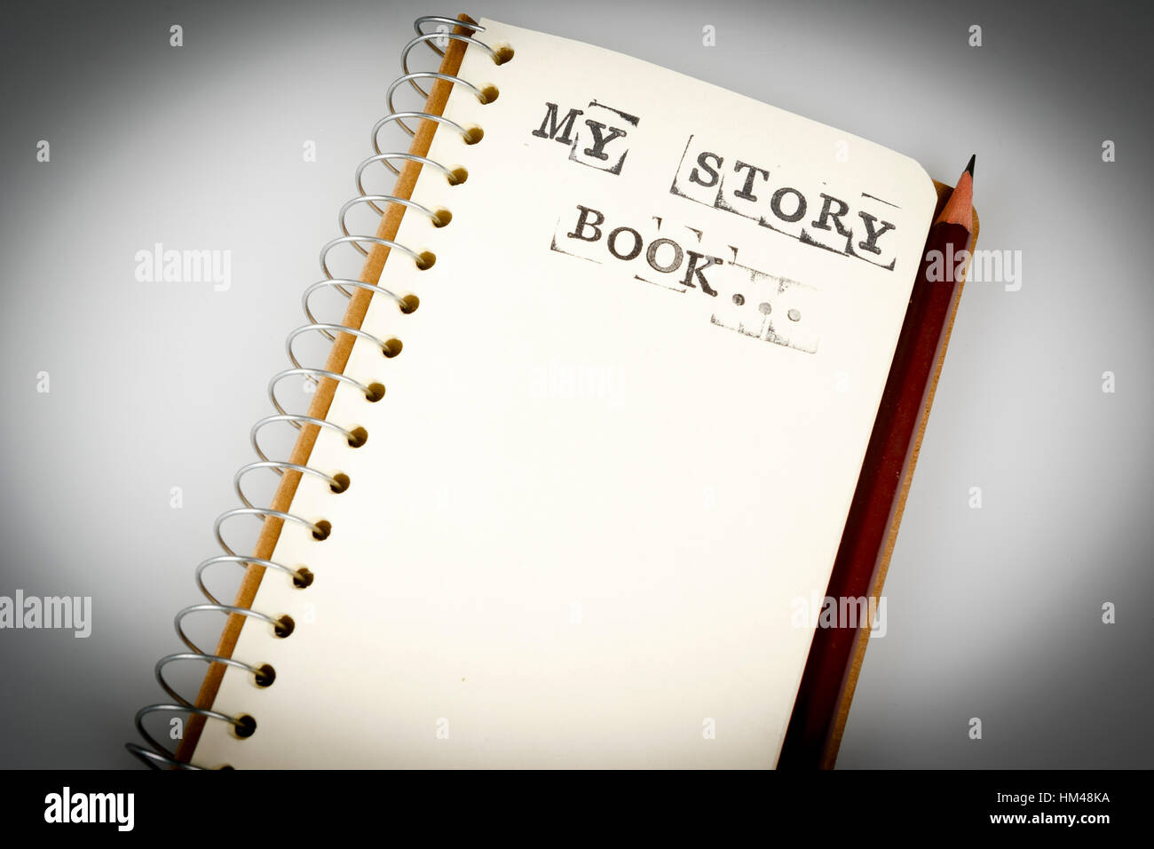 My story book on the white, Diary with text and pencil Stock Photo - Alamy