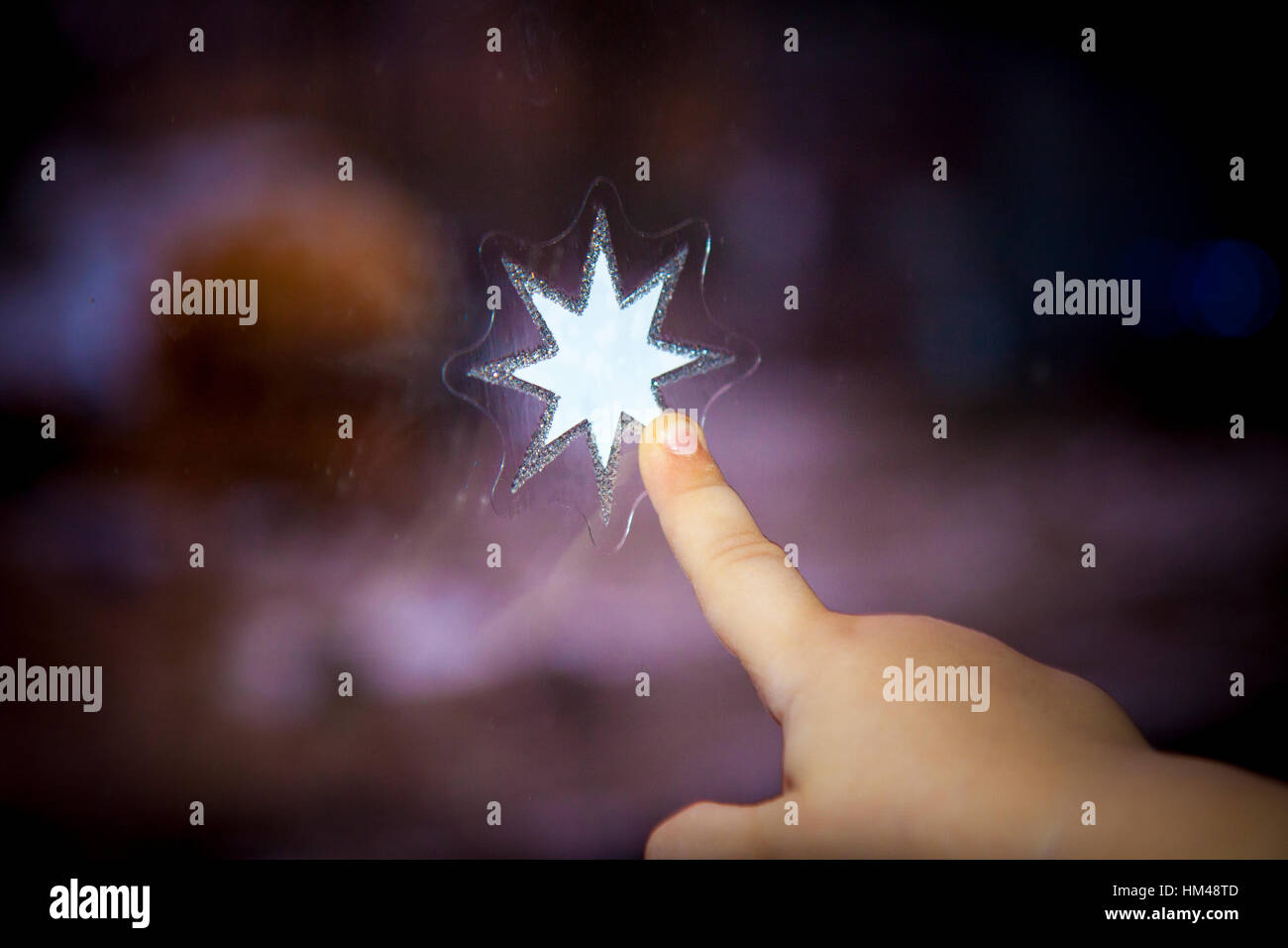 child hand and finger touching star decoration, christmas concept Stock ...