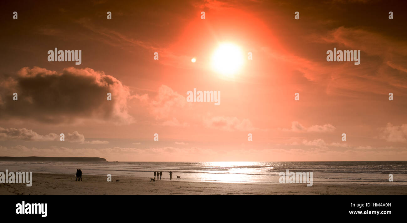 people on beach at sunset Stock Photo - Alamy