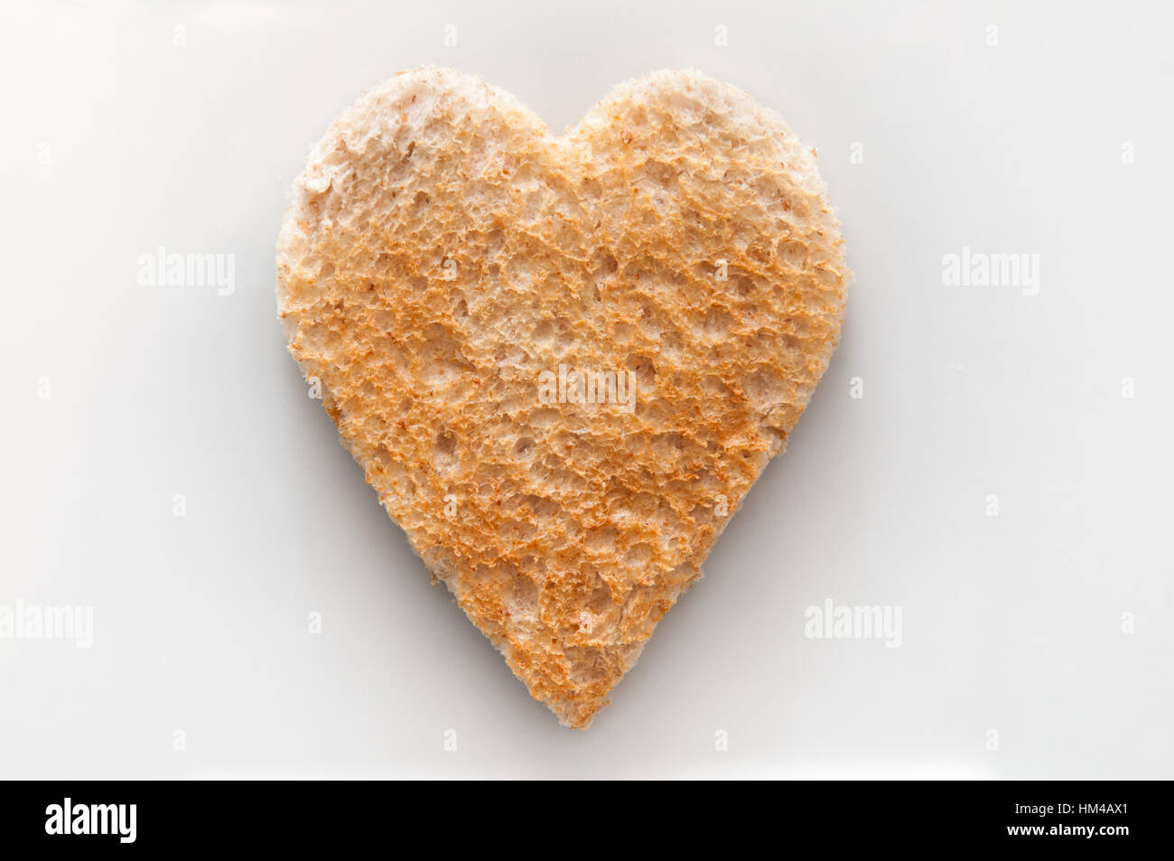 Love heart shape toast isolated on white Stock Photo - Alamy