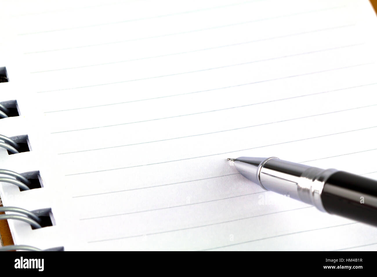 Open note book with pen Stock Photo - Alamy