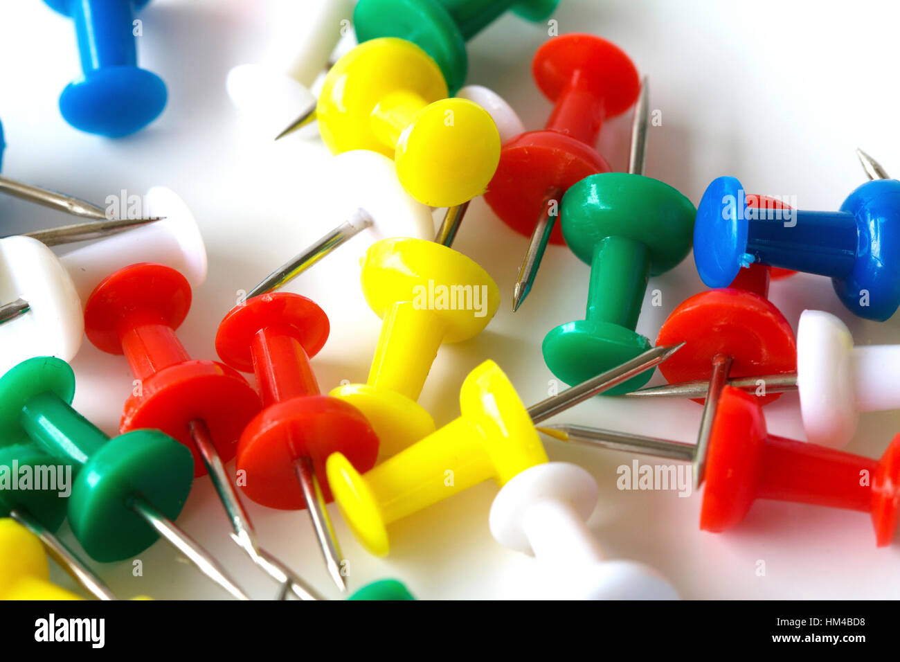 Group of colorful push pins on white background Stock Photo - Alamy