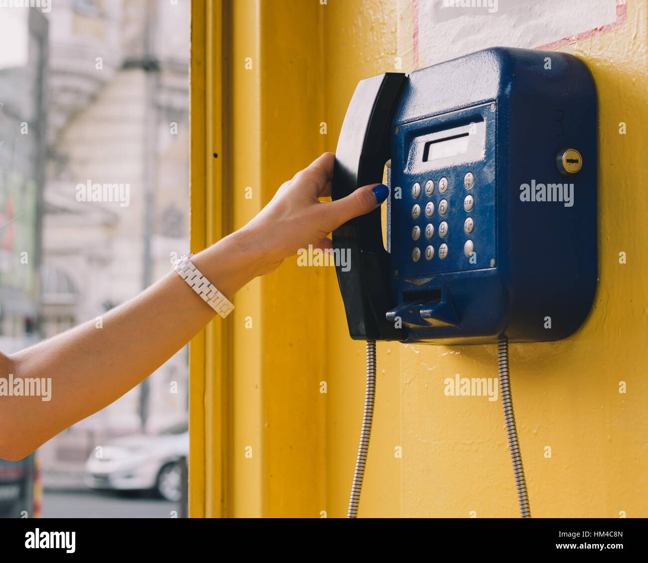 Girl calling from telephone booth hi-res stock photography and images ...