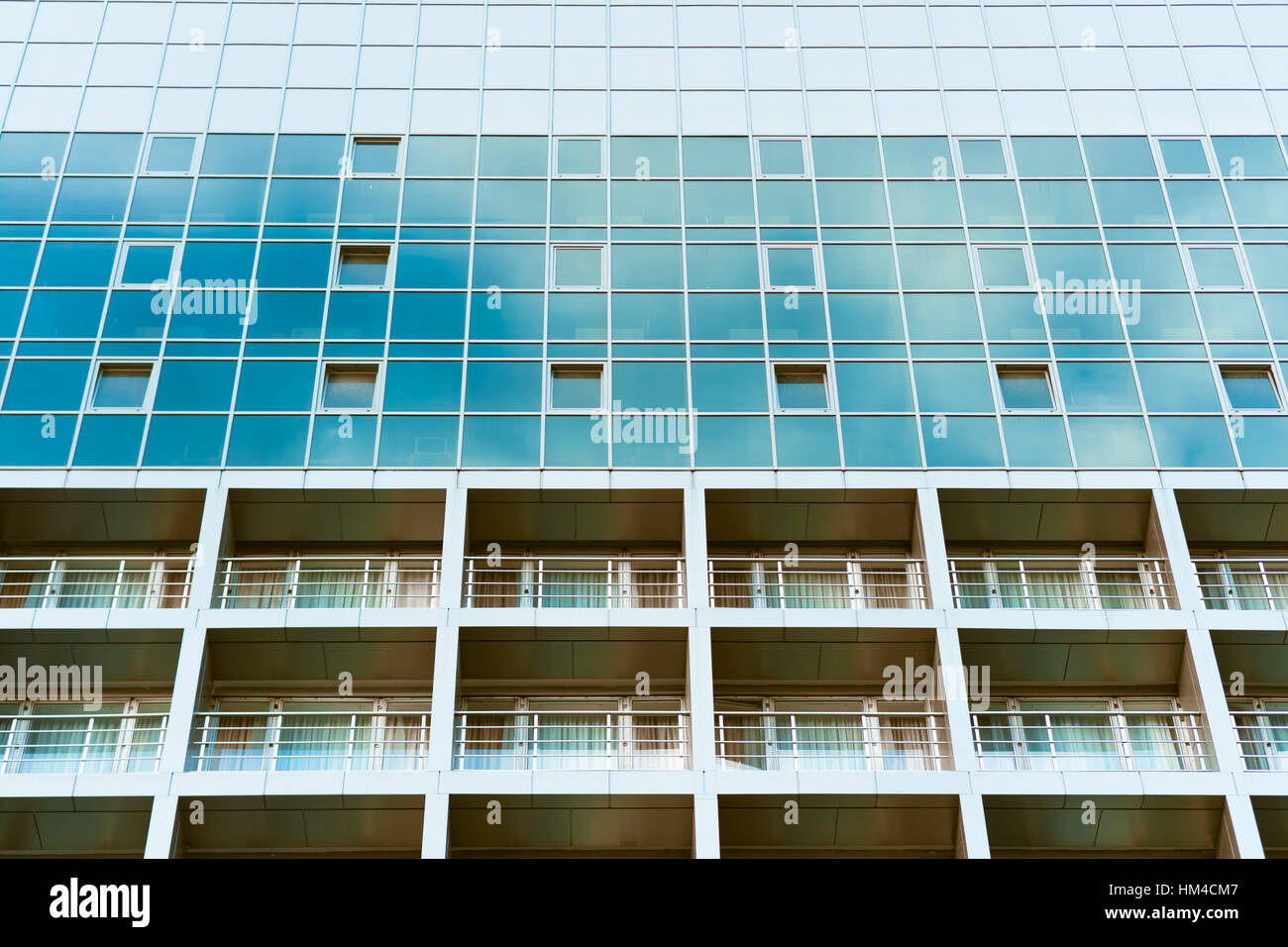 Blue glass building with balconies Stock Photo - Alamy