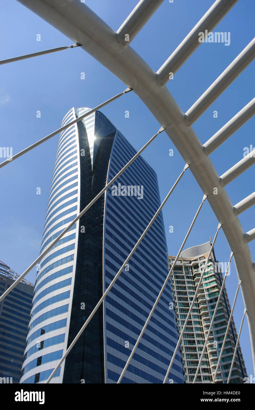 Sathorn Square building viewed through structure of pedestrian flyover ...