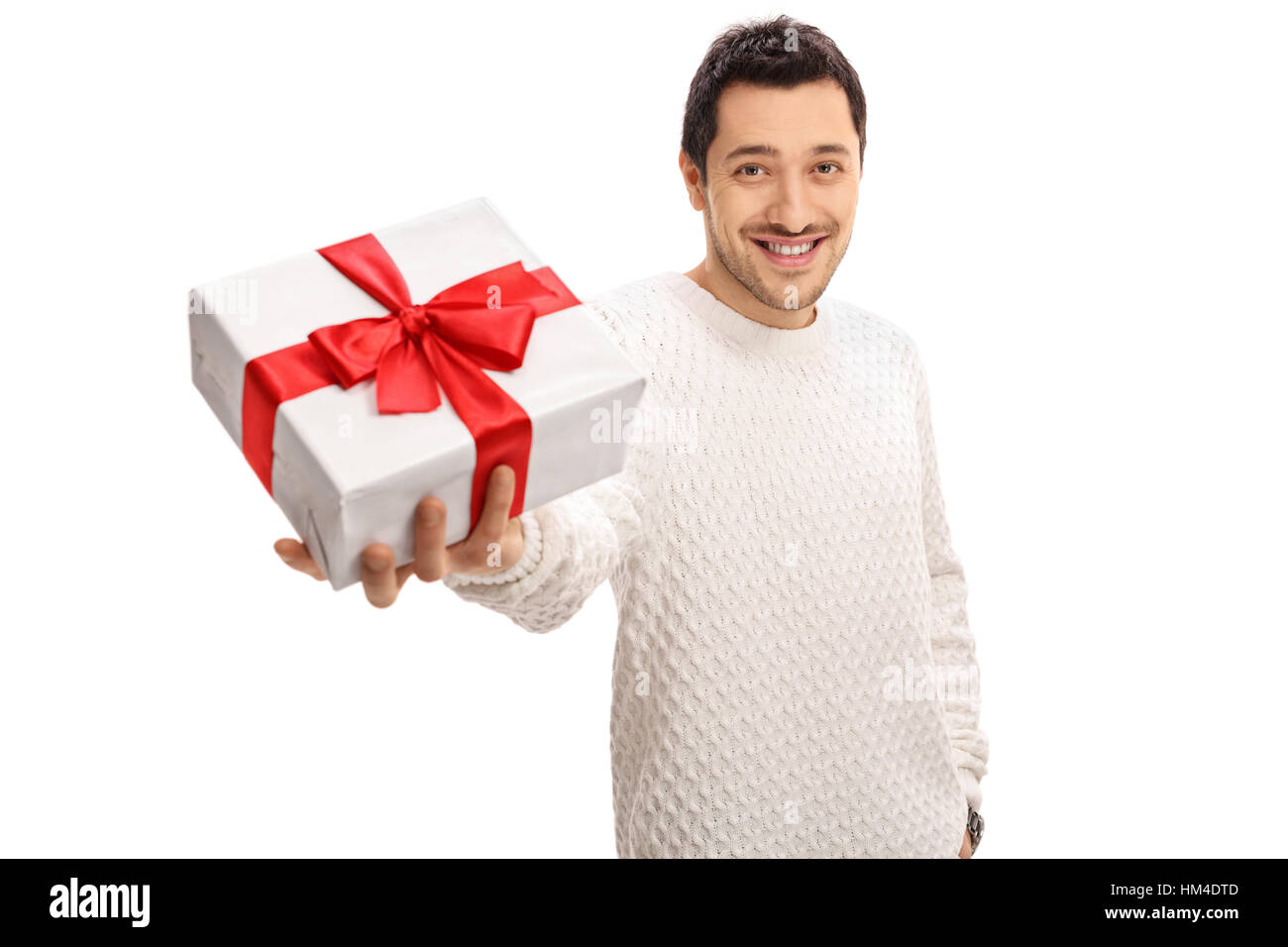 Happy man giving a present isolated on white background Stock Photo - Alamy
