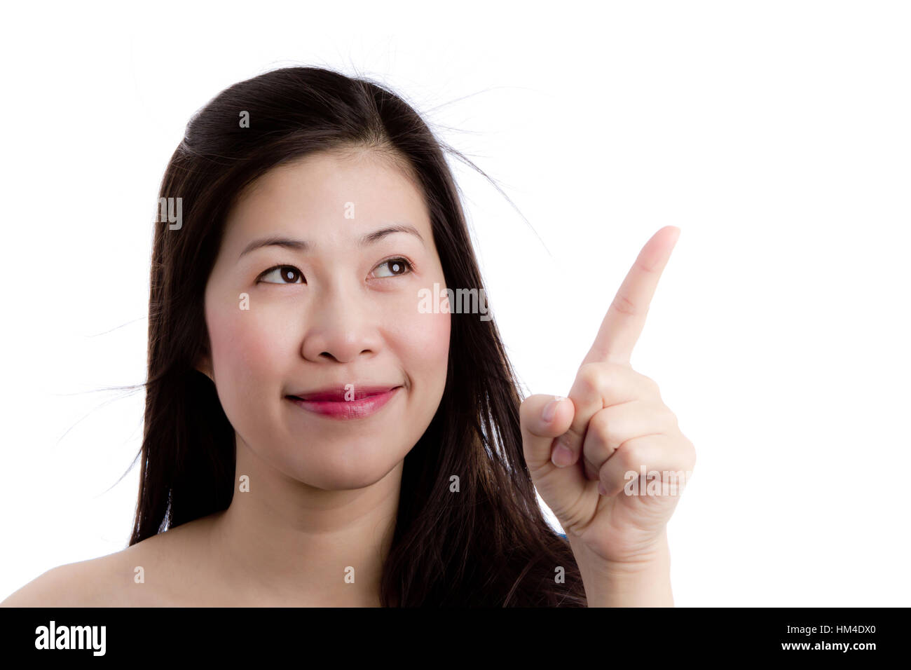Portrait of young woman pointing over white background Stock Photo - Alamy