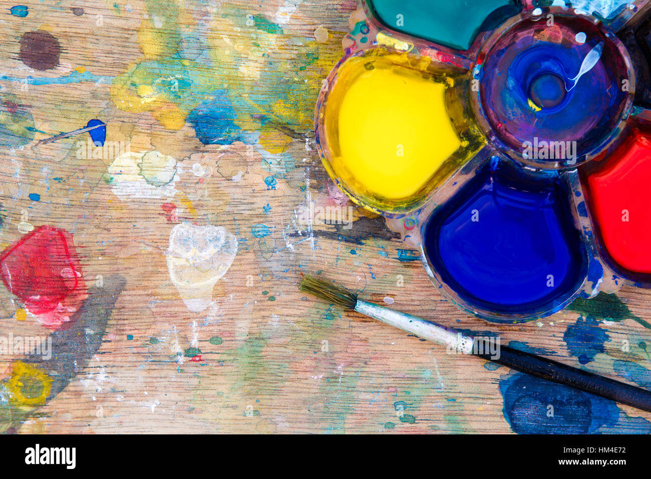 Paint buckets on grunge paint background Stock Photo - Alamy