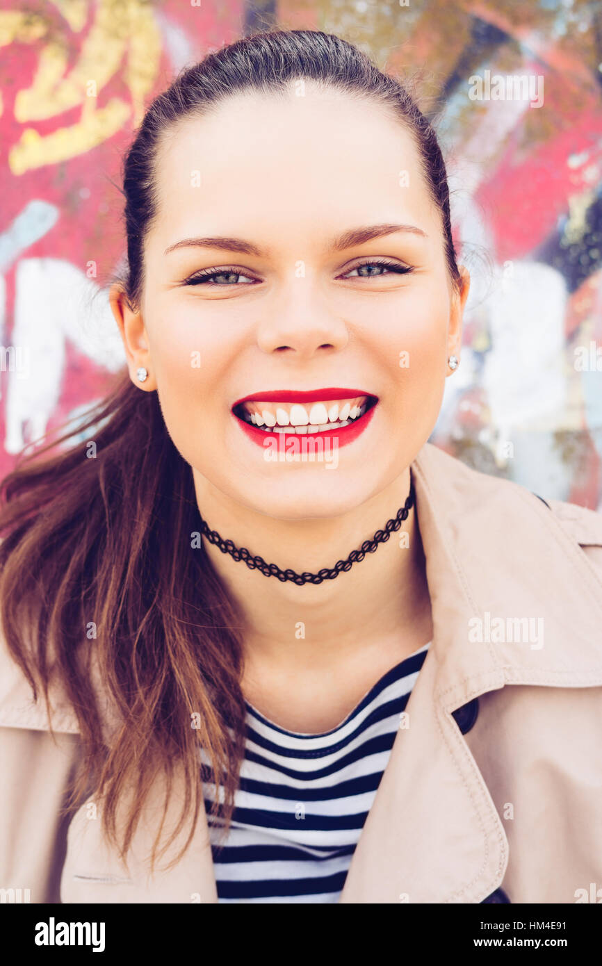 Portrait of a smiling emotional woman on a bright background. Cheerful ...