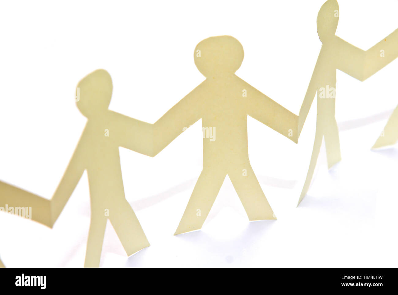 Cutout paper people over white background Stock Photo - Alamy
