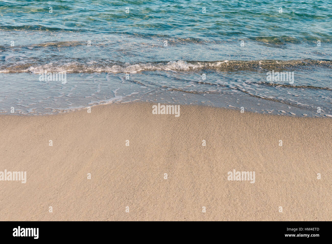 Smooth sand at the beach and clear sea water Stock Photo - Alamy