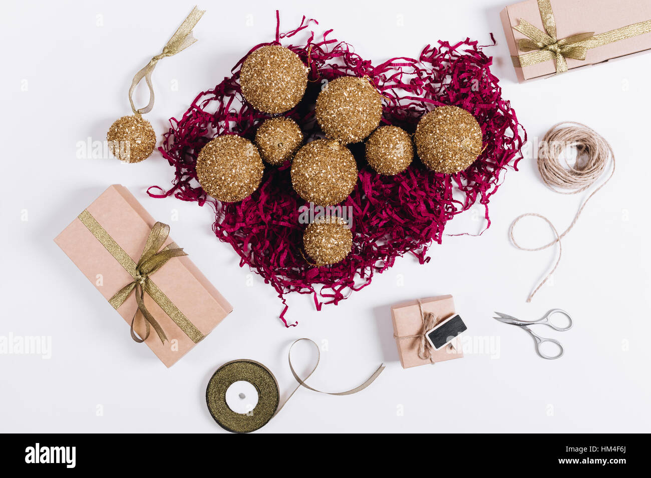 Christmas decorations, boxes with gifts, scissors and ribbons on a ...