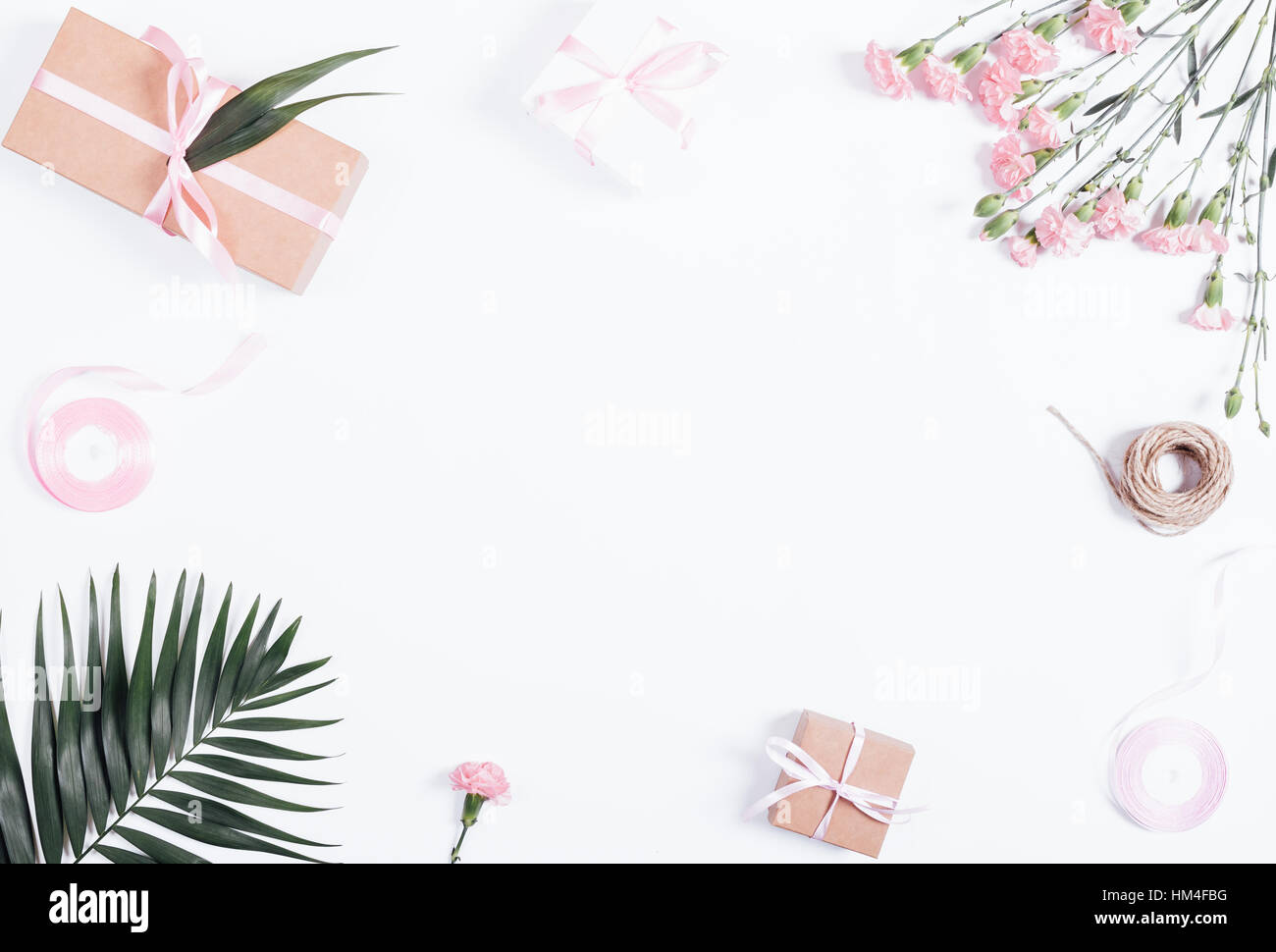 Festive composition: boxes with gifts, ribbons and flowers on white ...