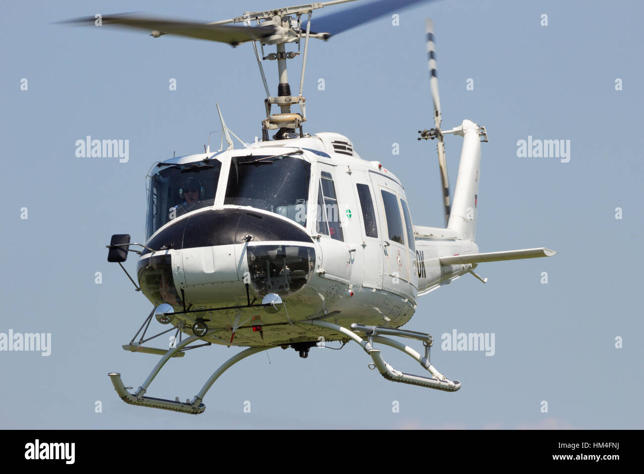 Front view of a white helicopter flying Stock Photo - Alamy