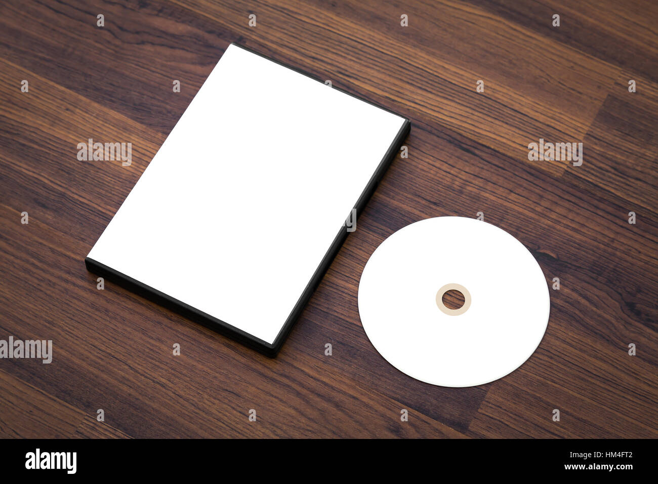 Blank compact disc with cover on wood background ground Stock Photo - Alamy