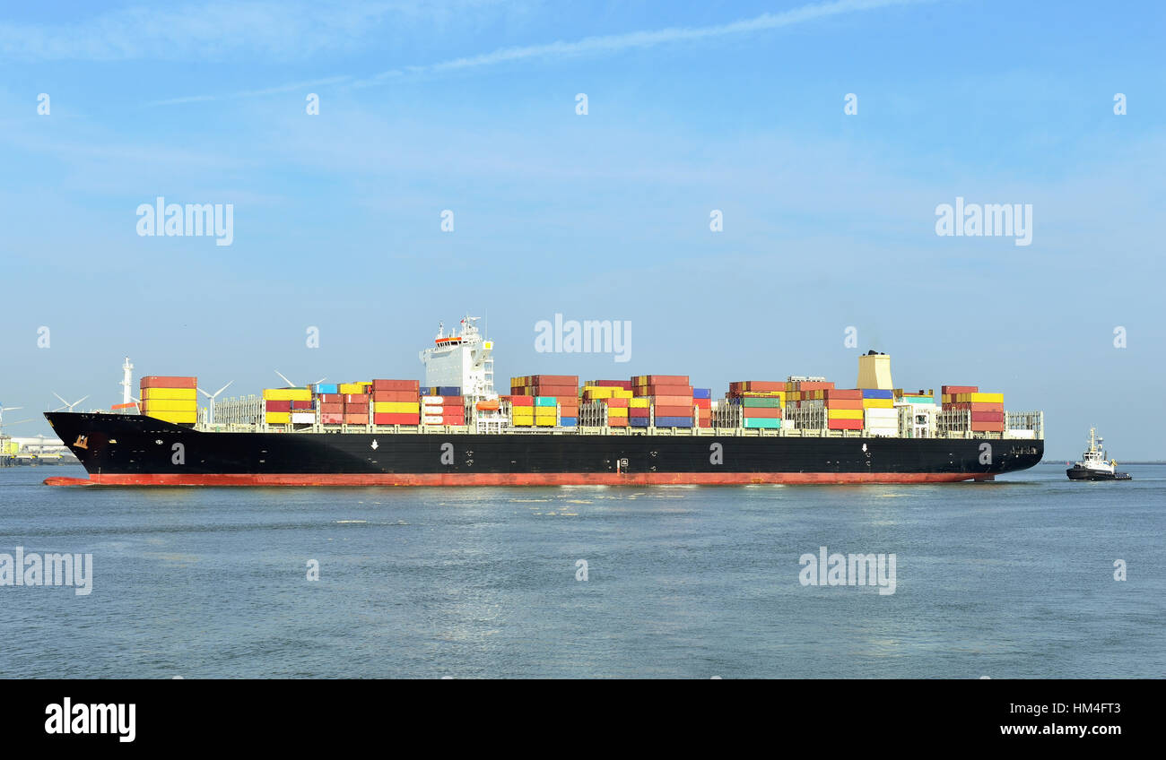 container ship sailing into the port of Rotterdam Stock Photo - Alamy