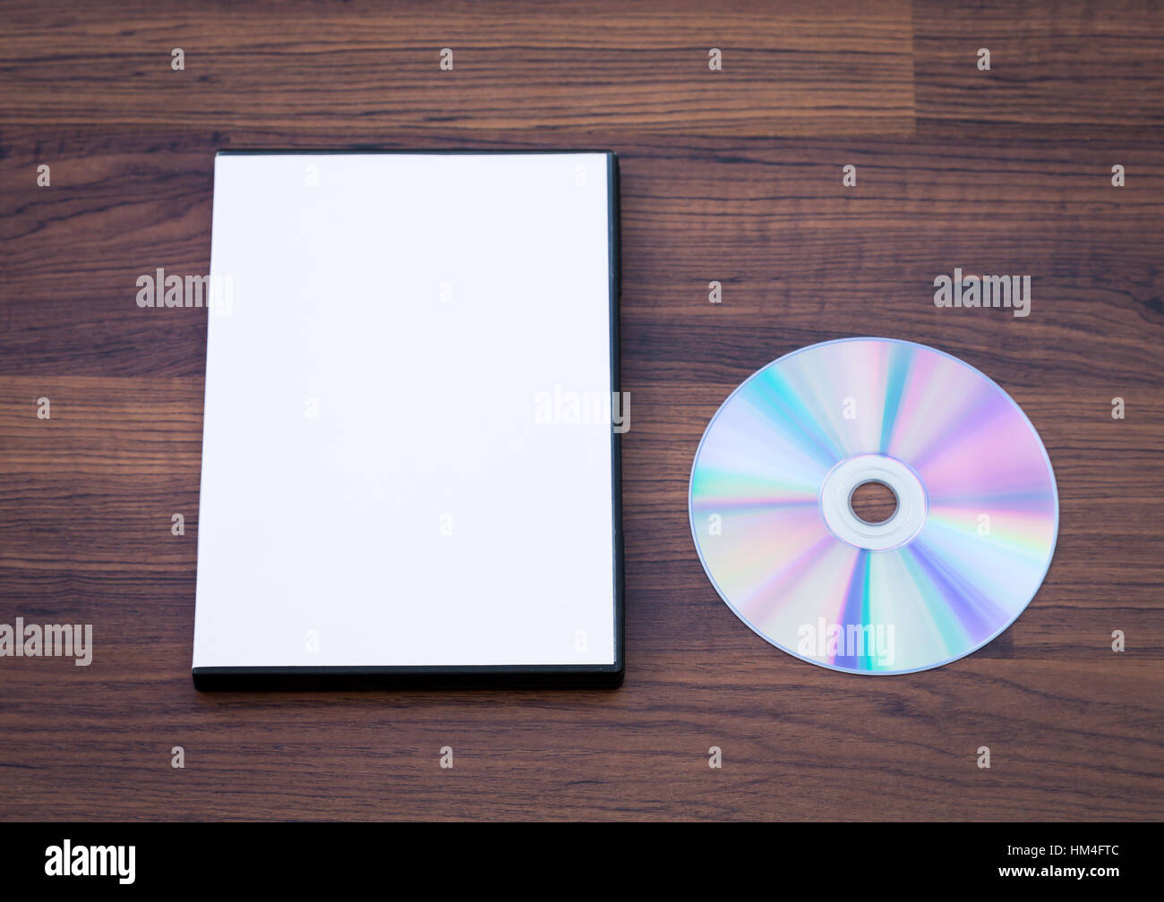 Blank compact disc with cover on wood background ground Stock Photo - Alamy