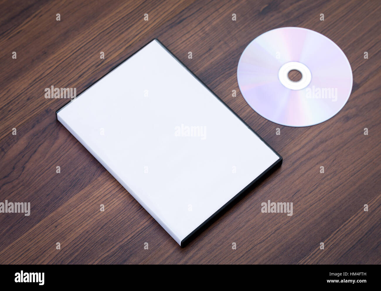 Blank compact disc with cover on wood background ground Stock Photo - Alamy