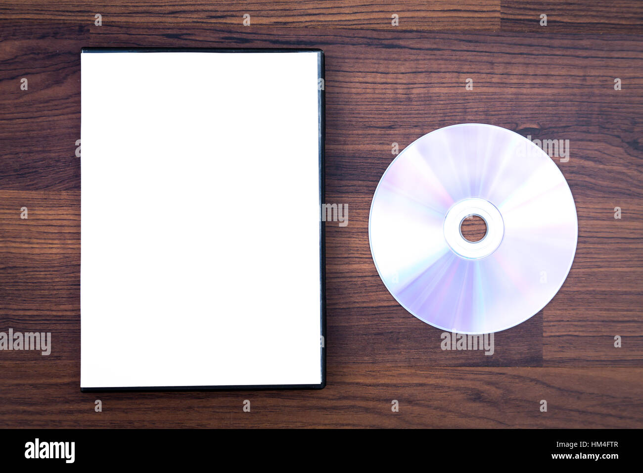Blank compact disc with cover on wood background ground Stock Photo - Alamy