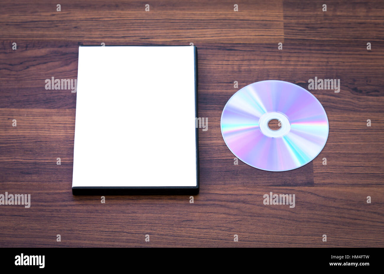 Blank compact disc with cover on wood background ground Stock Photo - Alamy