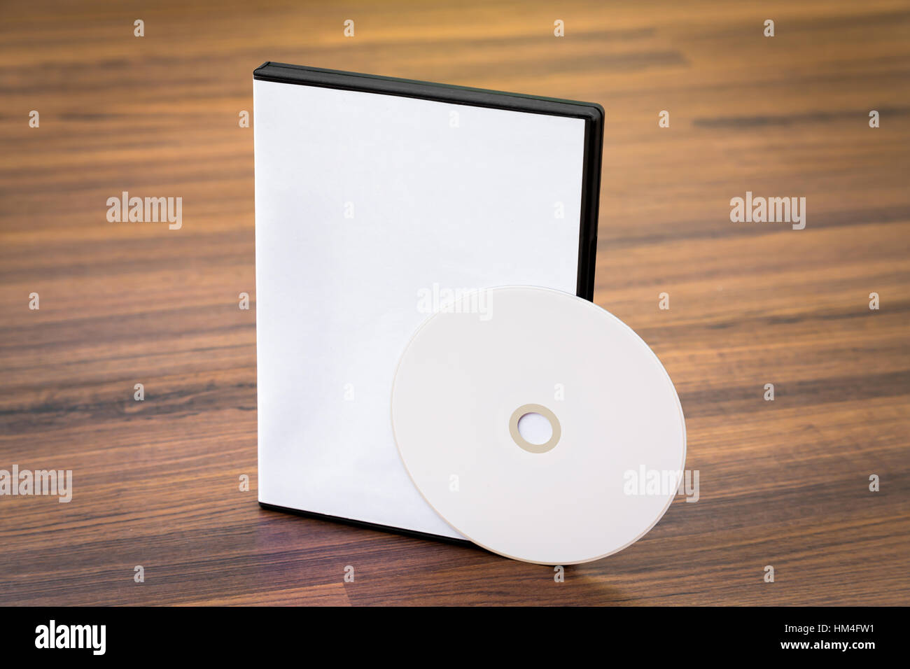 Blank compact disc with cover on wood background ground Stock Photo - Alamy