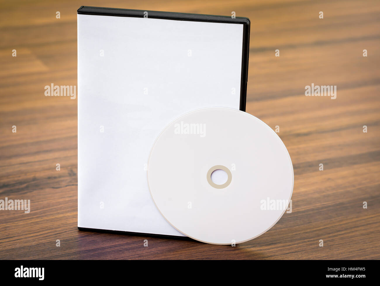 Blank compact disc with cover on wood background ground Stock Photo - Alamy