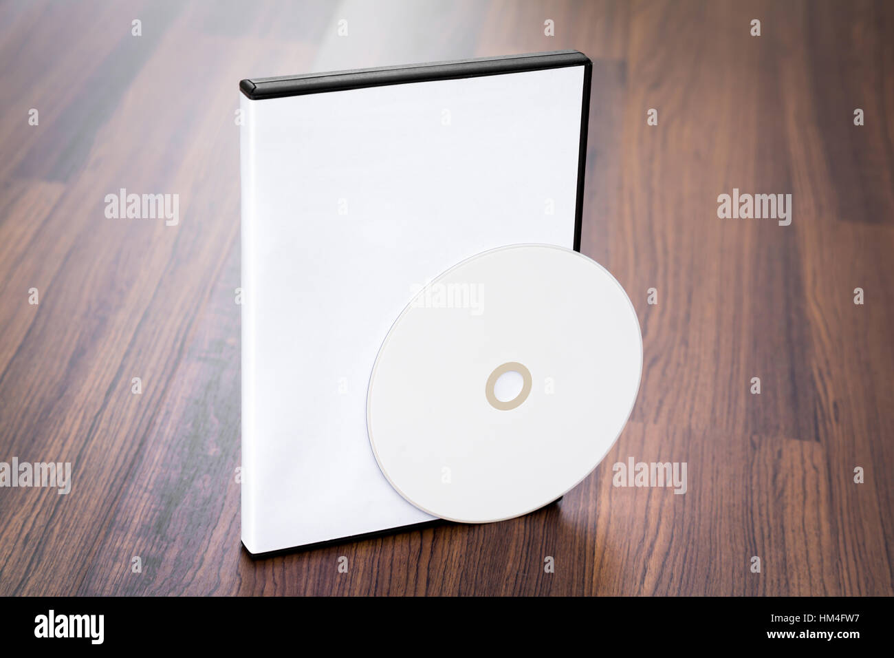 Blank compact disc with cover on wood background ground Stock Photo - Alamy