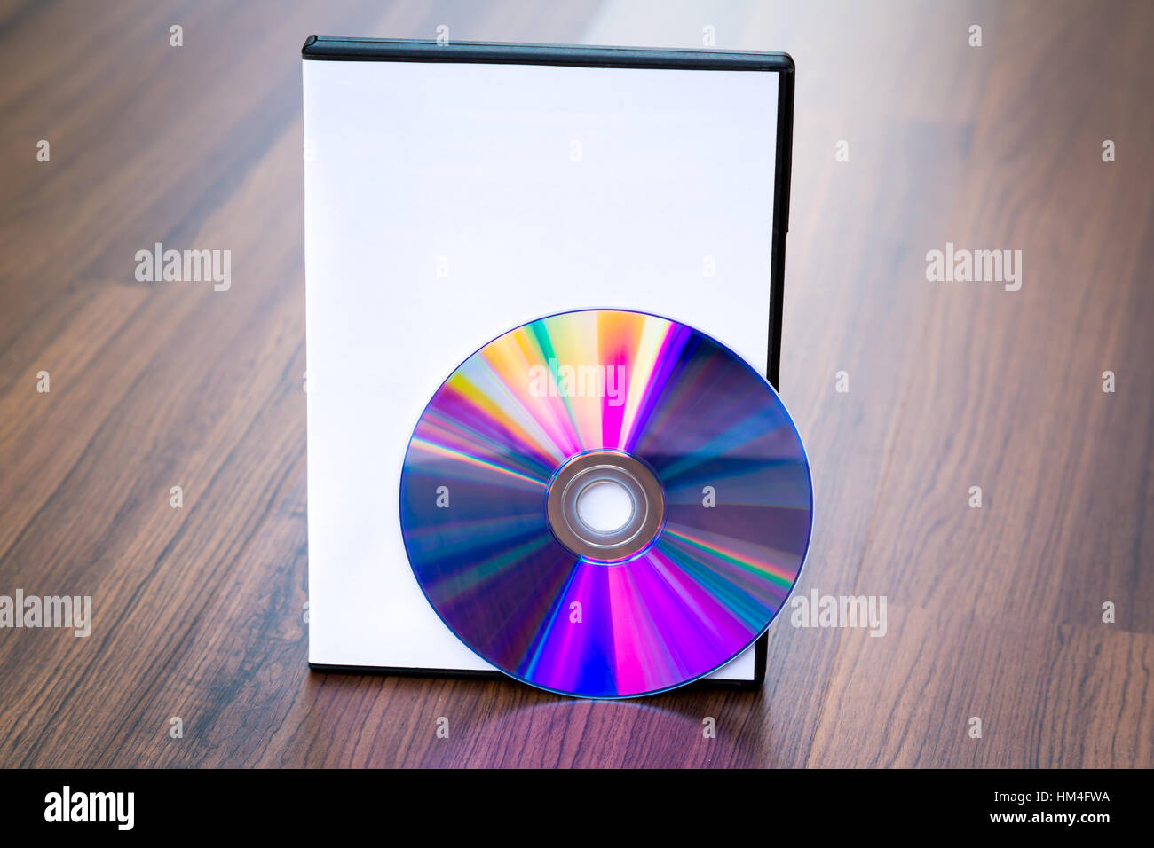 Blank compact disc with cover on wood background ground Stock Photo - Alamy