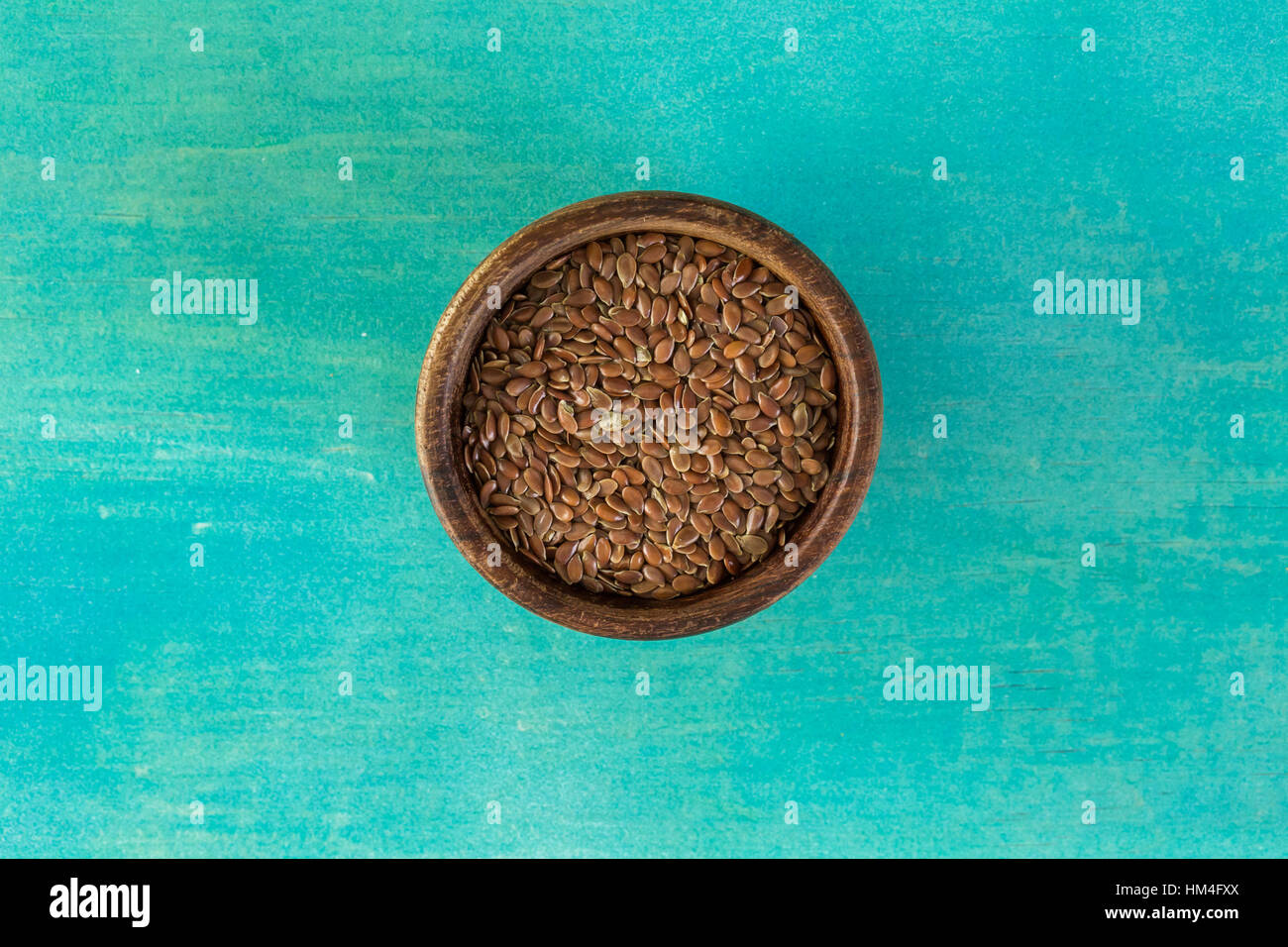 Flax seeds on painted wood board Stock Photo - Alamy