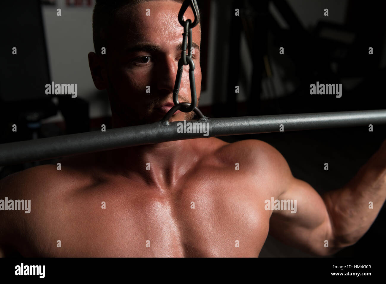 Muscular Athletic Bodybuilder Fitness Model Doing Heavy Weight Exercise ...